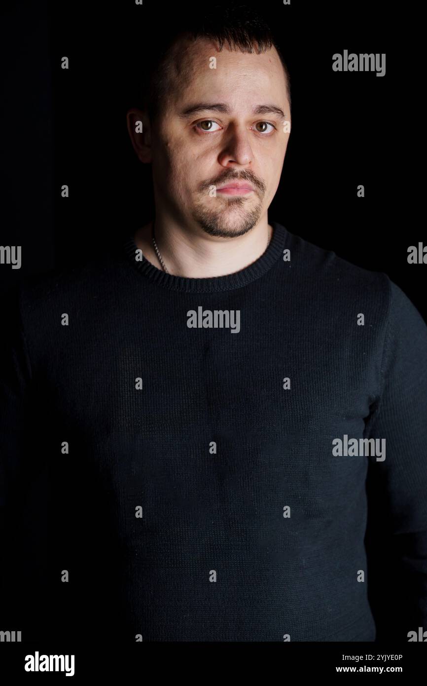 Portrait of a Confident Man in a Dark Setting Stock Photo - Alamy