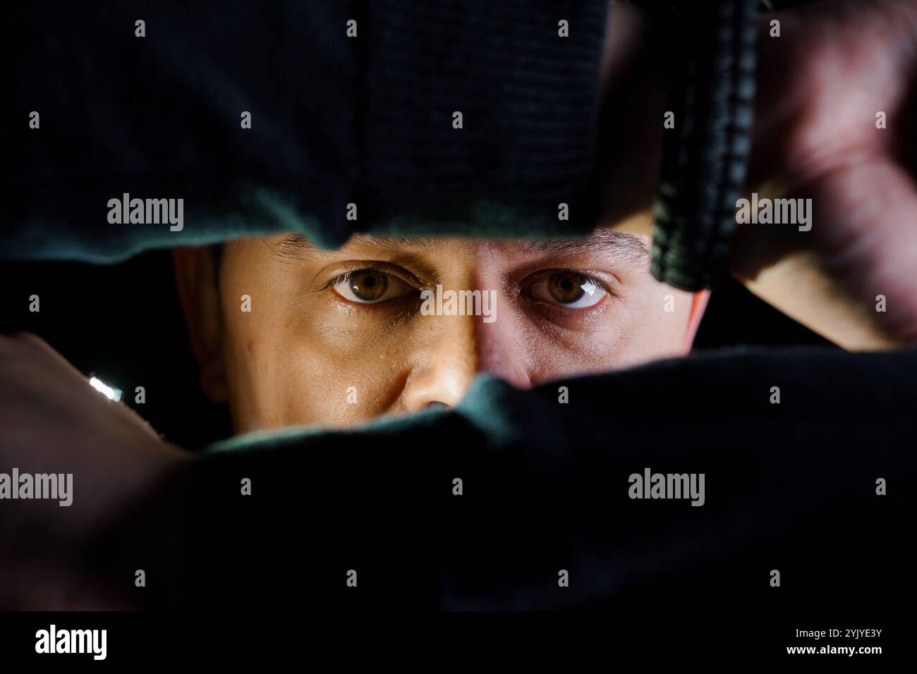 Introspective Gaze: The Depth of Reflection in Dim Light Stock Photo ...