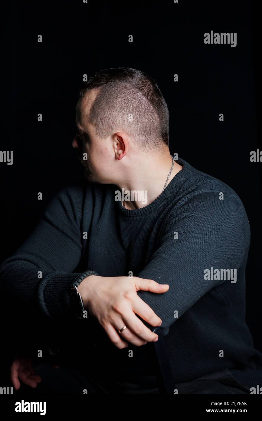 Portrait of a Man in Contemplation with a Natural Black Background ...
