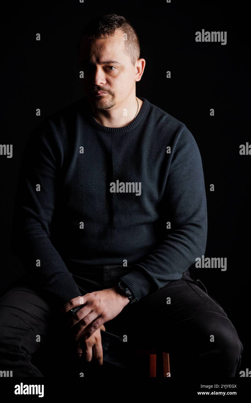 Portrait of a Contemplative Man in Shadows Stock Photo - Alamy