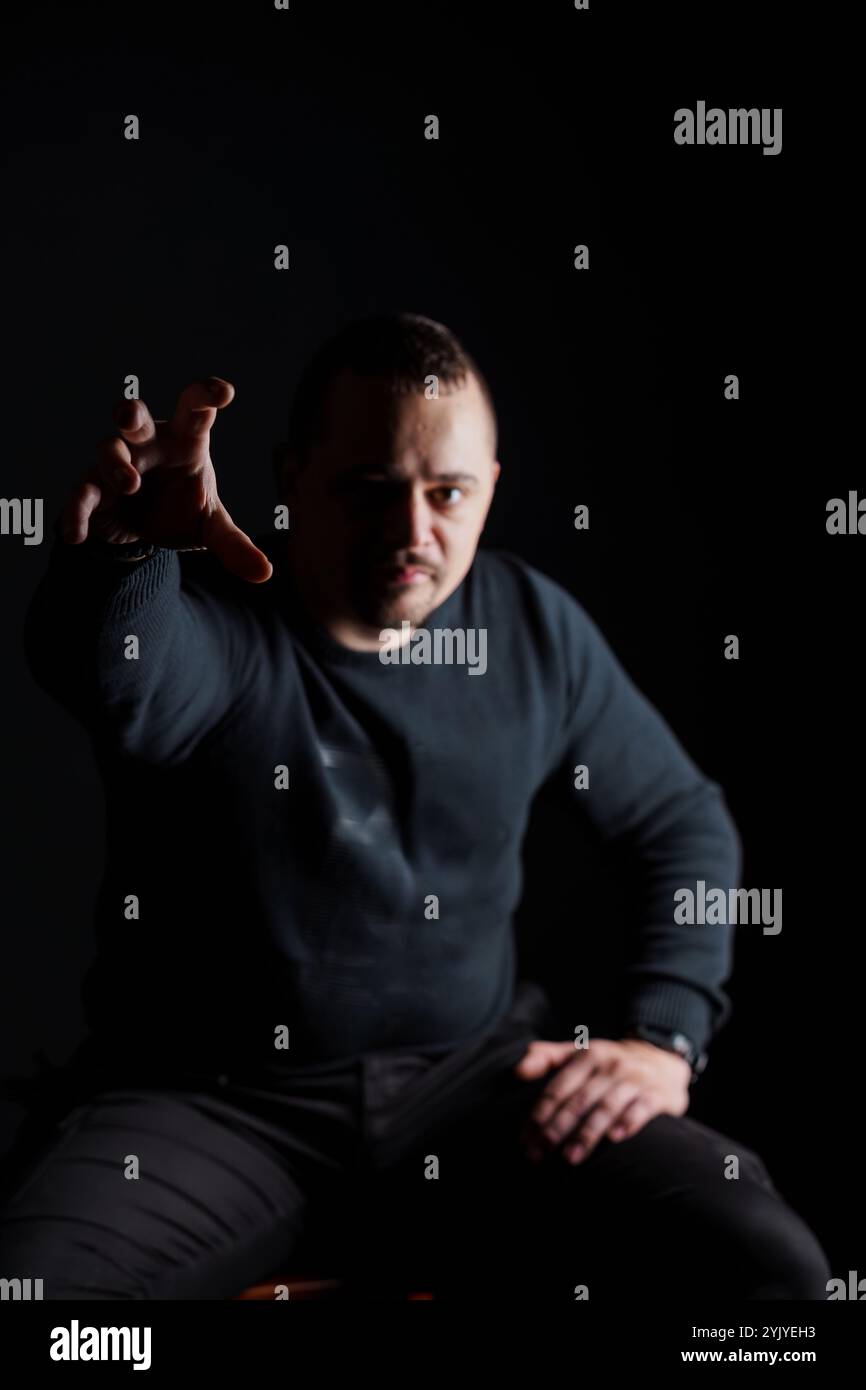 Intense Expression of Determination in Shadowy Portrait Stock Photo - Alamy