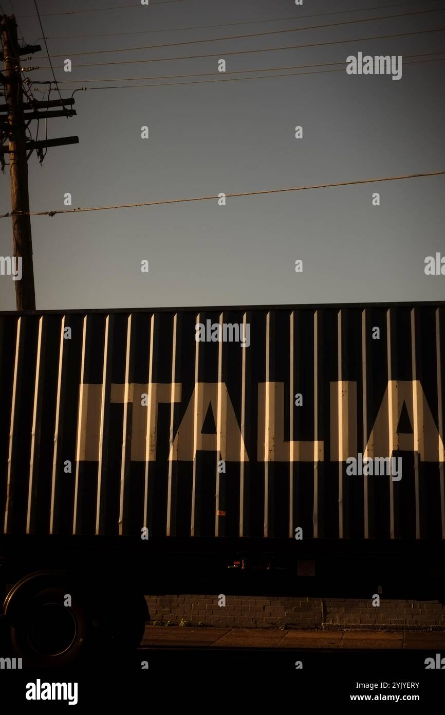 vertical lines of sunlight on a corrugated shipping container, printed ...