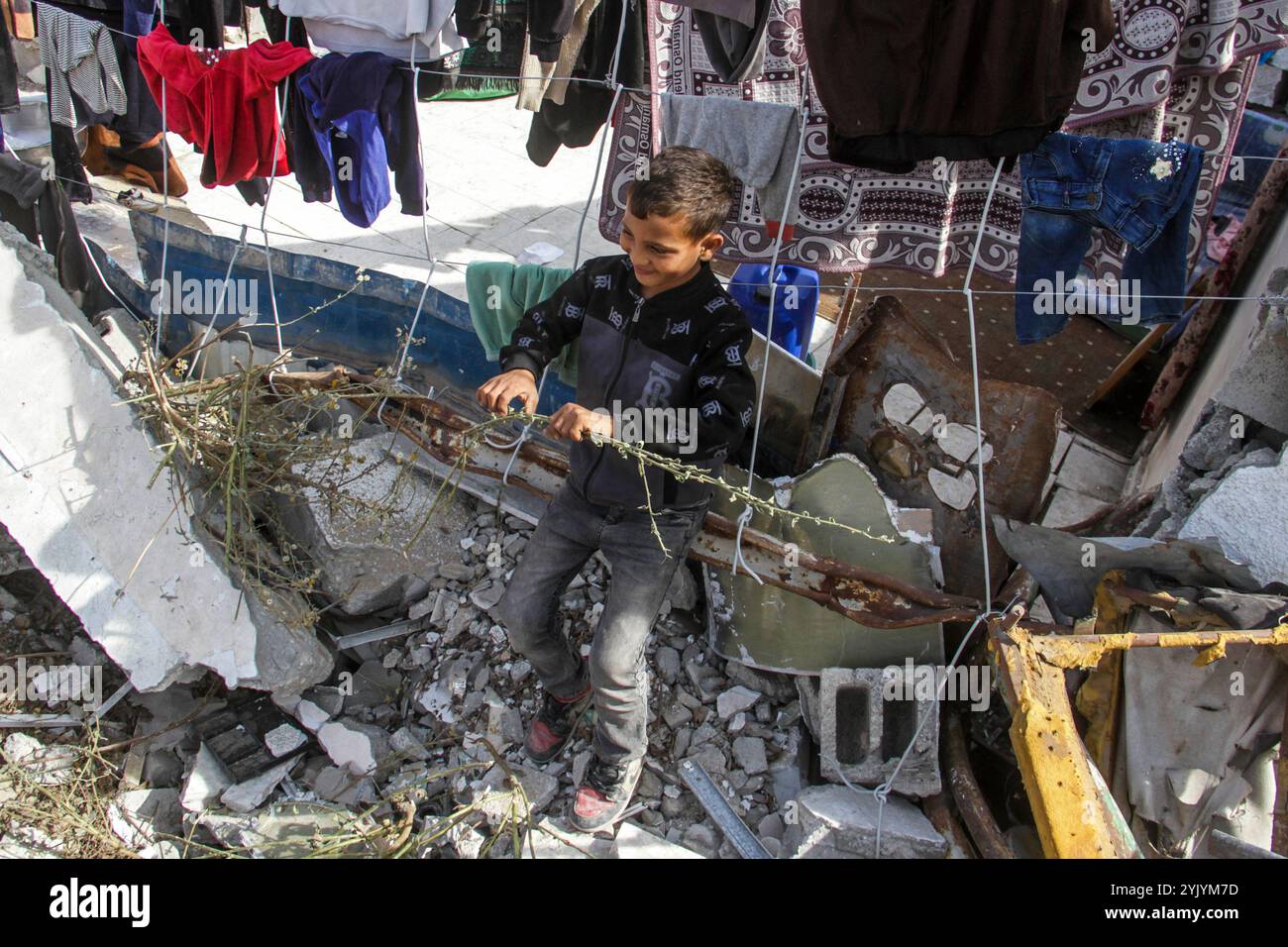 Gaza City. 15th Nov, 2024. A boy of displaced Palestinian Saed Ghanim's ...