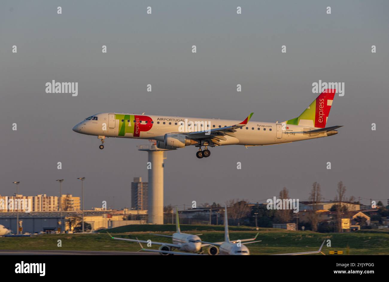 Tap air portugal embraer 190 is landing at lisbon airport Stock Photo ...