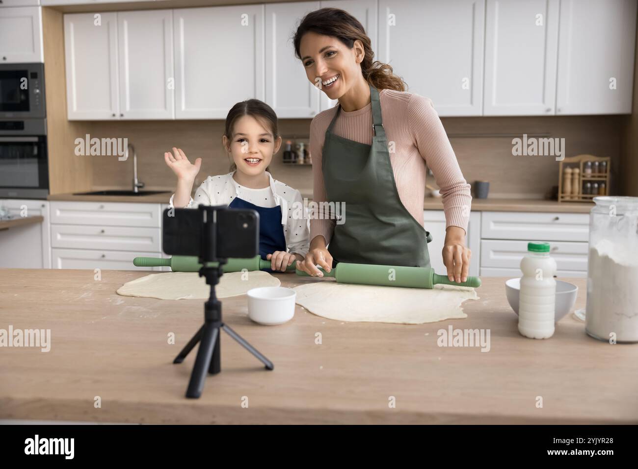 Mom and daughter start recording food vlog for channel Stock Photo - Alamy