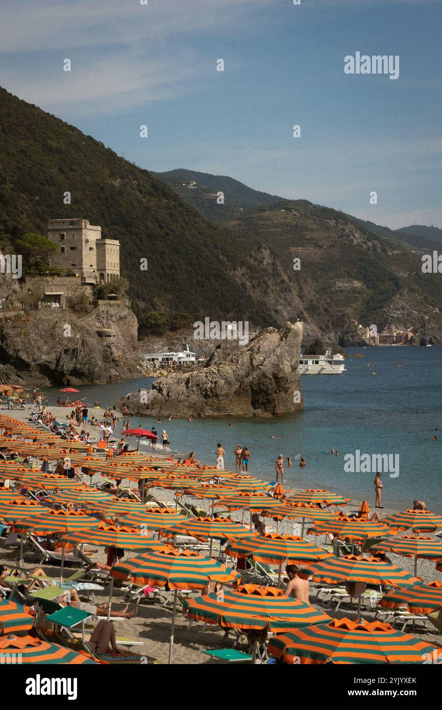 Vibrant Beachscape with Umbrellas in Monterosso, Cinque Terre, Italy Stock Photo - Alamy