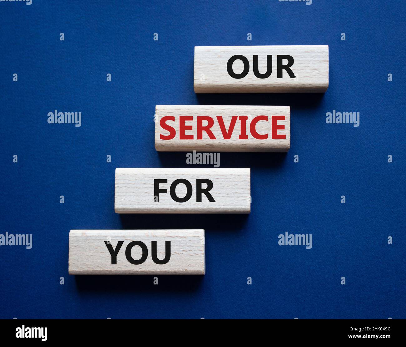 Our service for you symbol. Wooden blocks with words Our service for ...