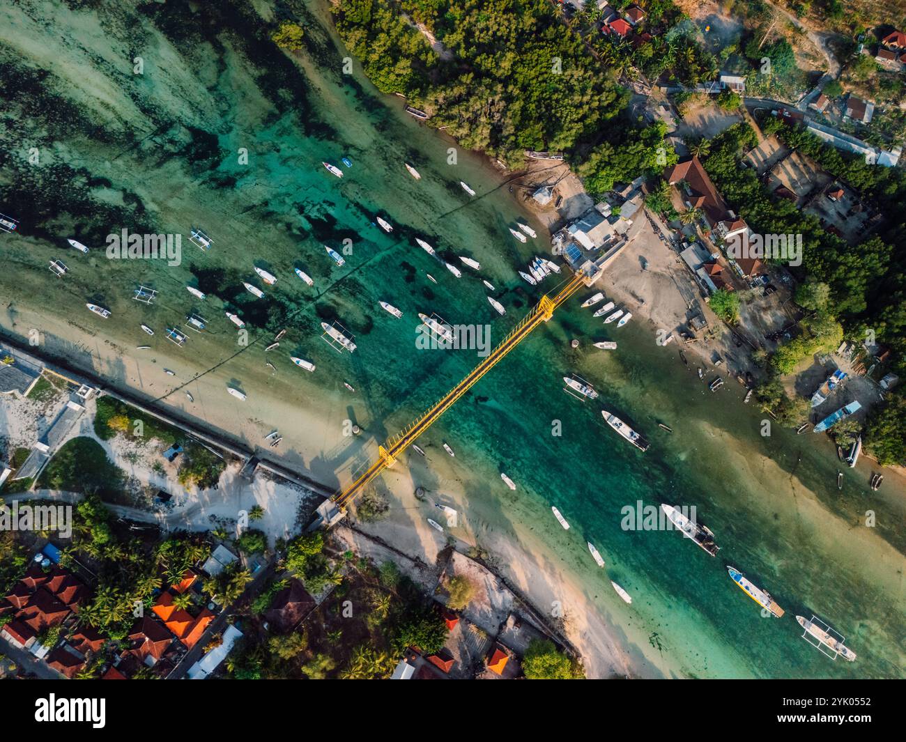 Aerial view of a bridge connecting two tropical islands over a narrow ...
