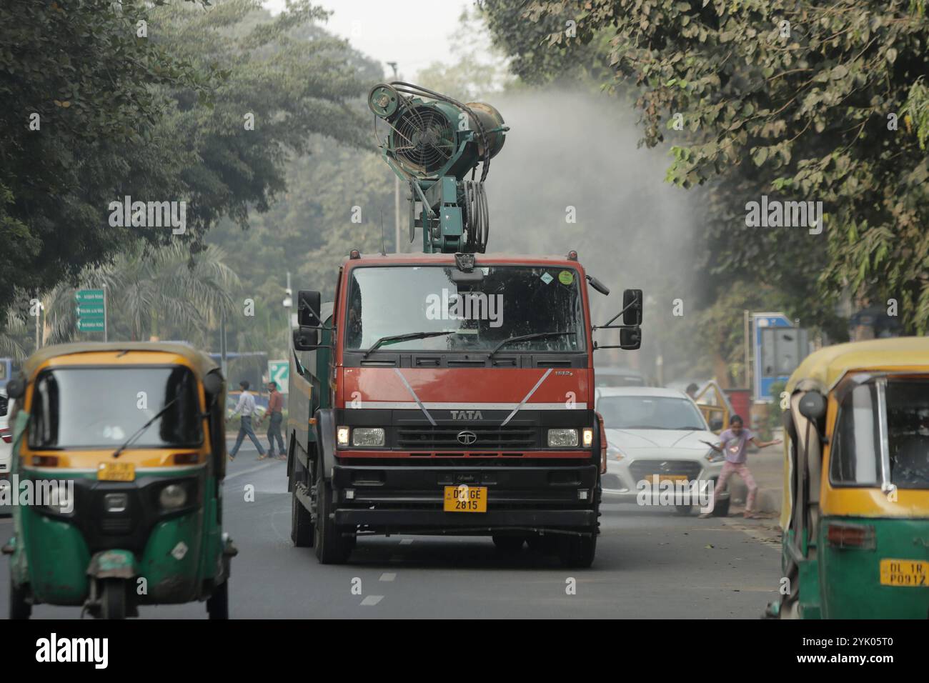 An anti smog gun tanker machine sprays water amidst smog in New Delhi ...