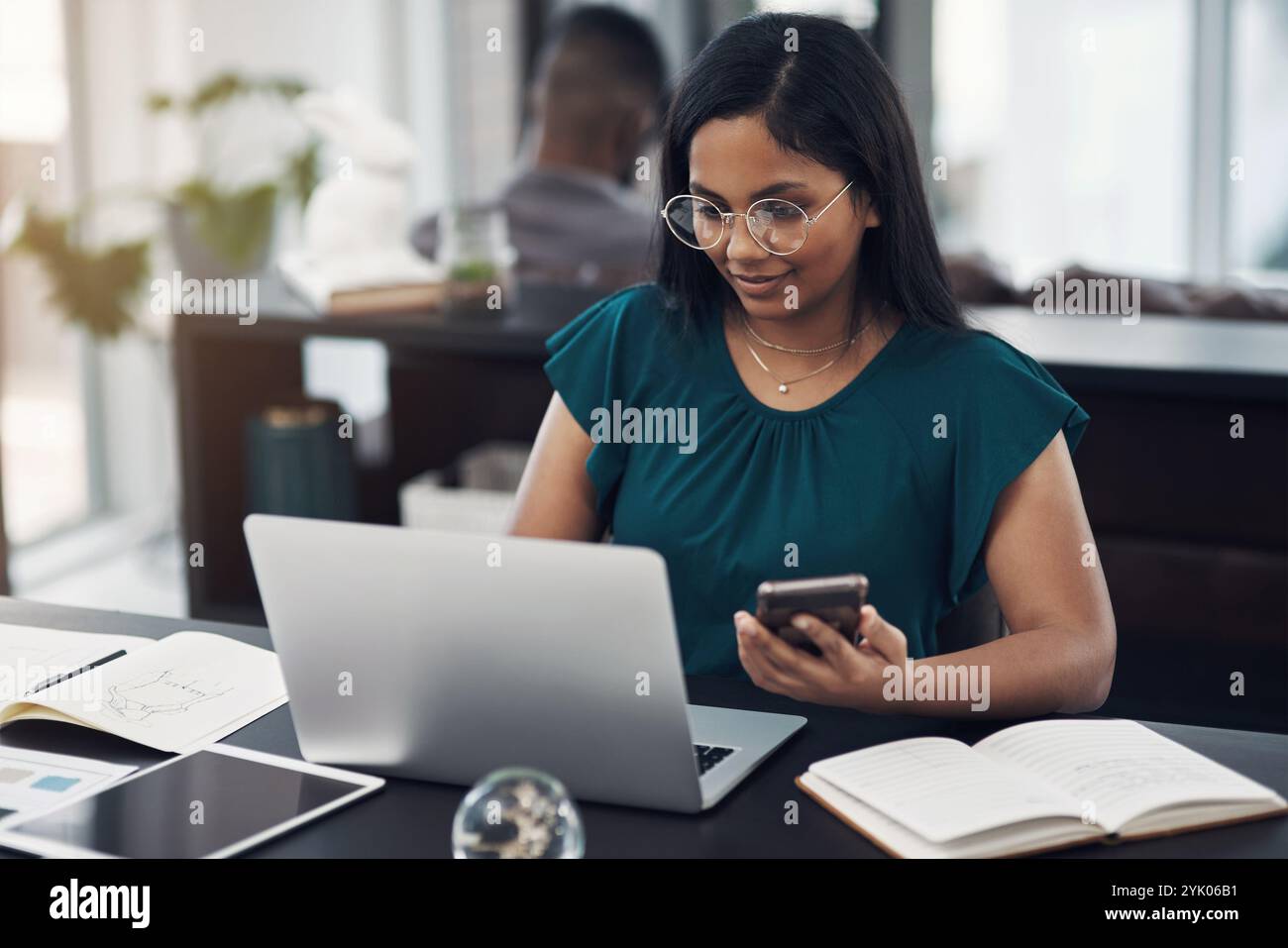 Woman, laptop and phone for typing in office, editing novel and online ...