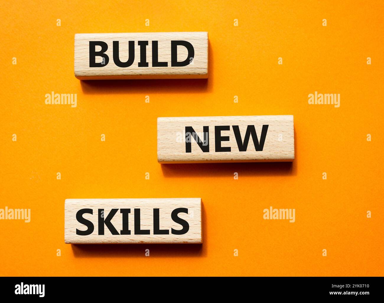 Build New skills symbol. Concept word Build New skills on wooden blocks ...