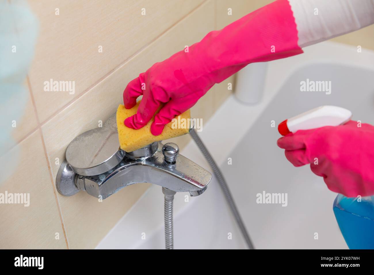 Thoroughly cleaning bathroom fixtures with a sponge and sprays is ...