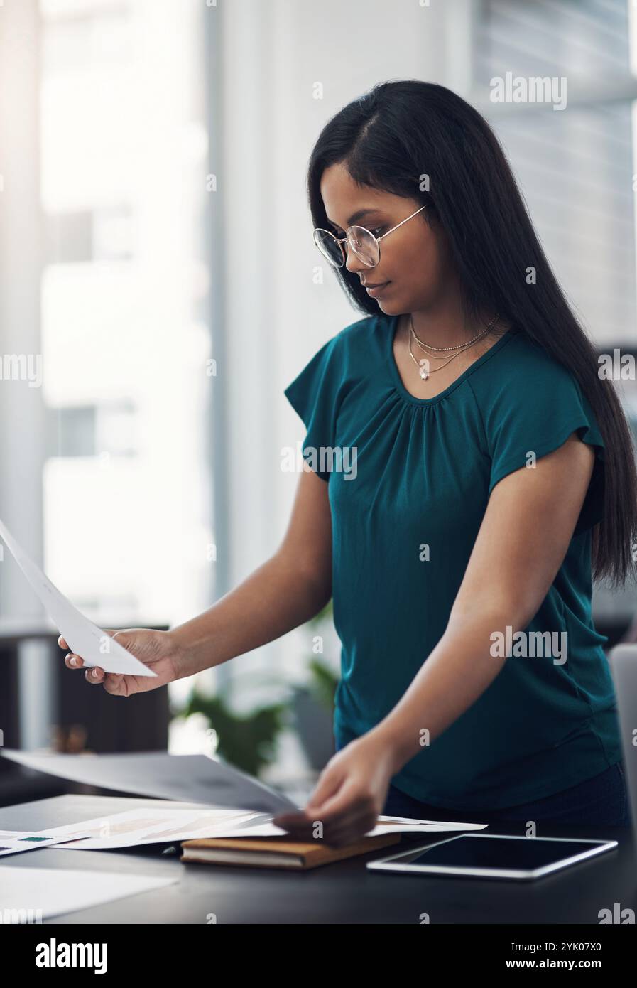 Woman, paper and office for creative magazine, photography options and ...