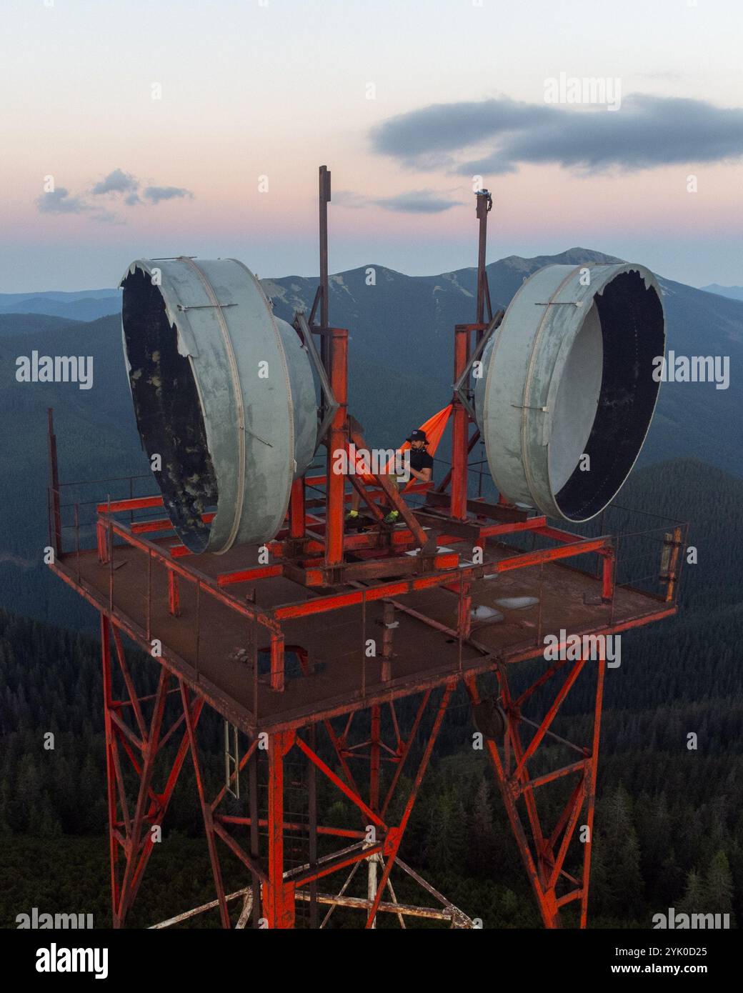 man in hammock on watchtower in a mountains Stock Photo - Alamy