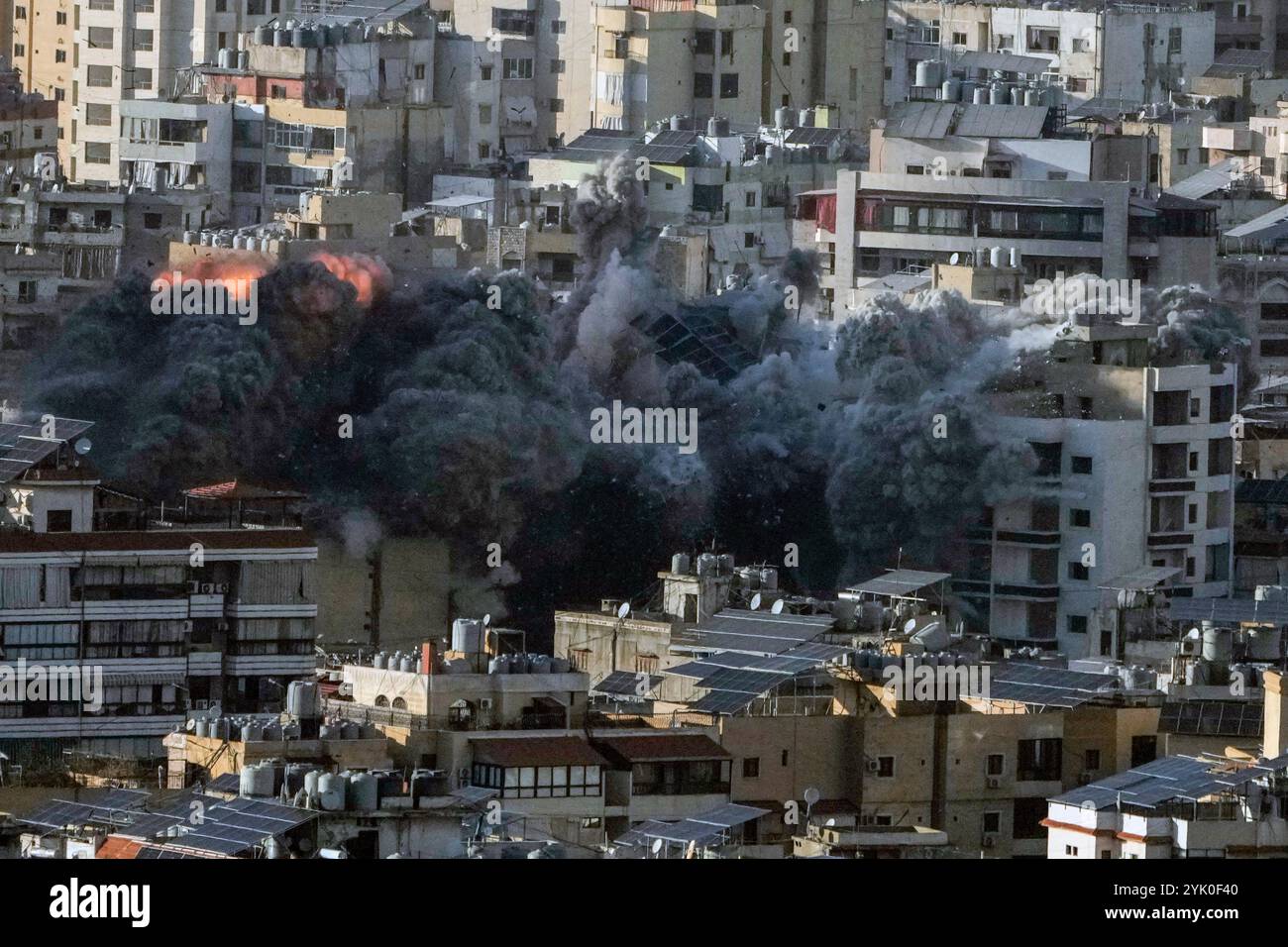 Flame and smoke rise after an Israeli airstrike on Dahiyeh, in the ...