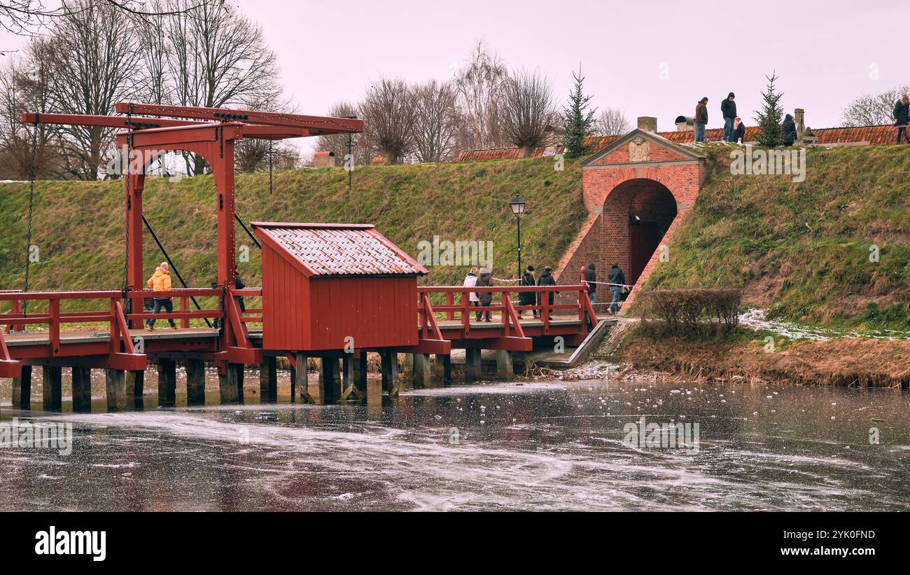 A winter view of the Bourtange fortress moat with a historic drawbridge ...