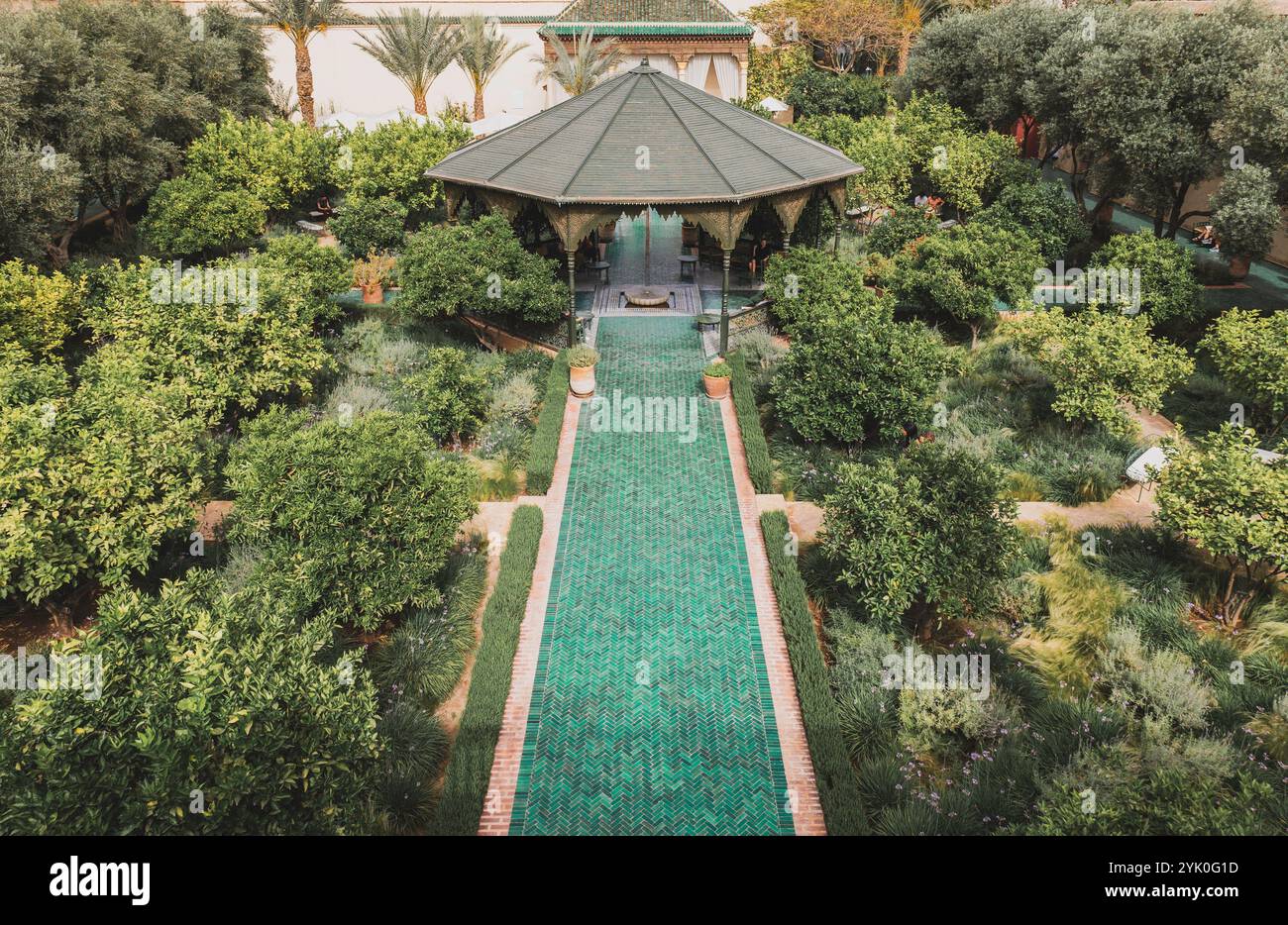 Vibrant green tiled garden path through Le Jardin Secret, Marrakech ...