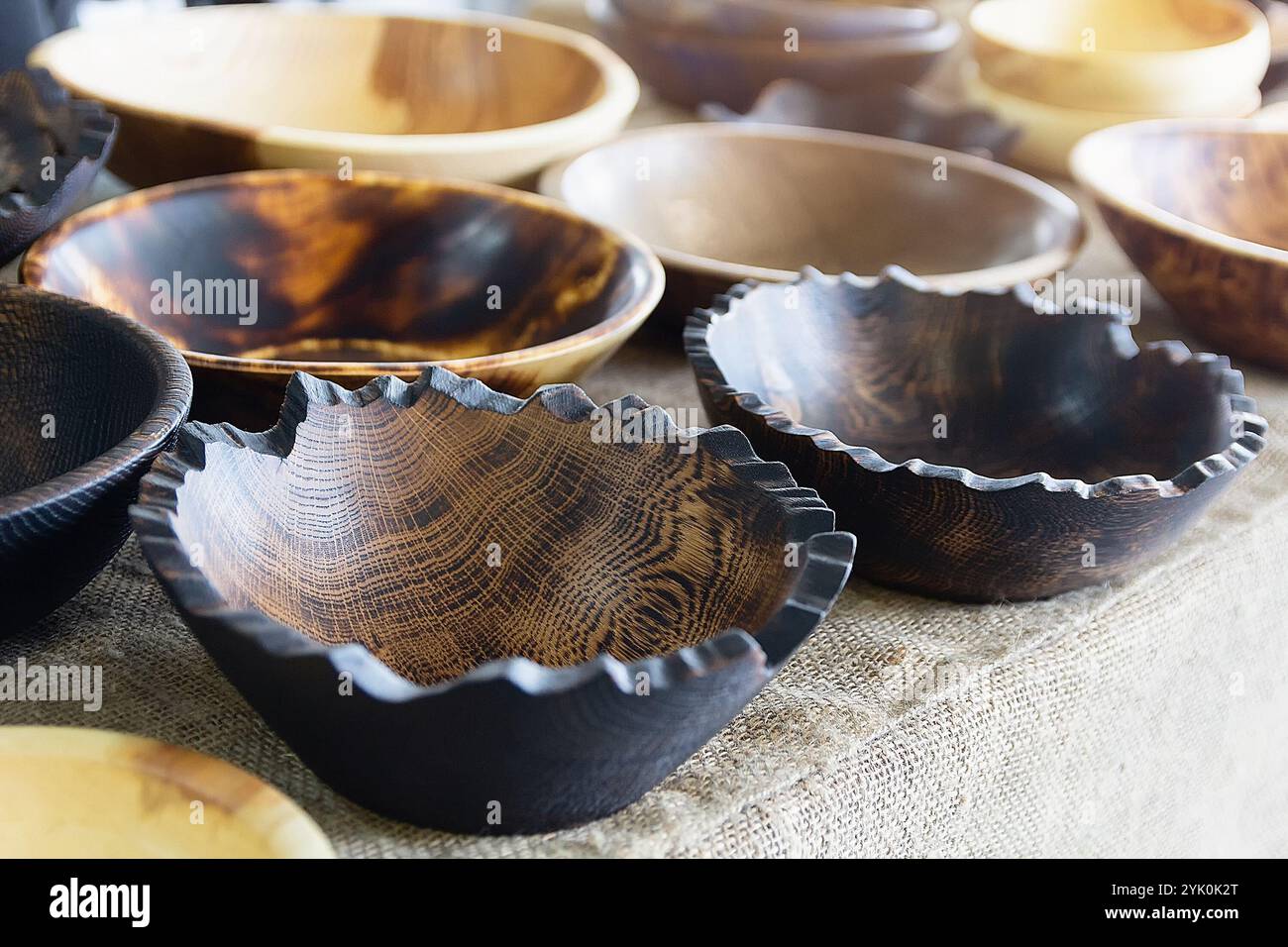 Modern utensils carved from wood at the market Stock Photo - Alamy