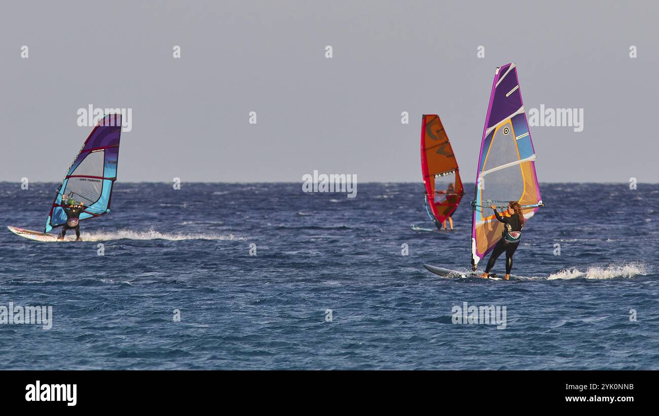 Three people sailing on windsurfing hi-res stock photography and images ...