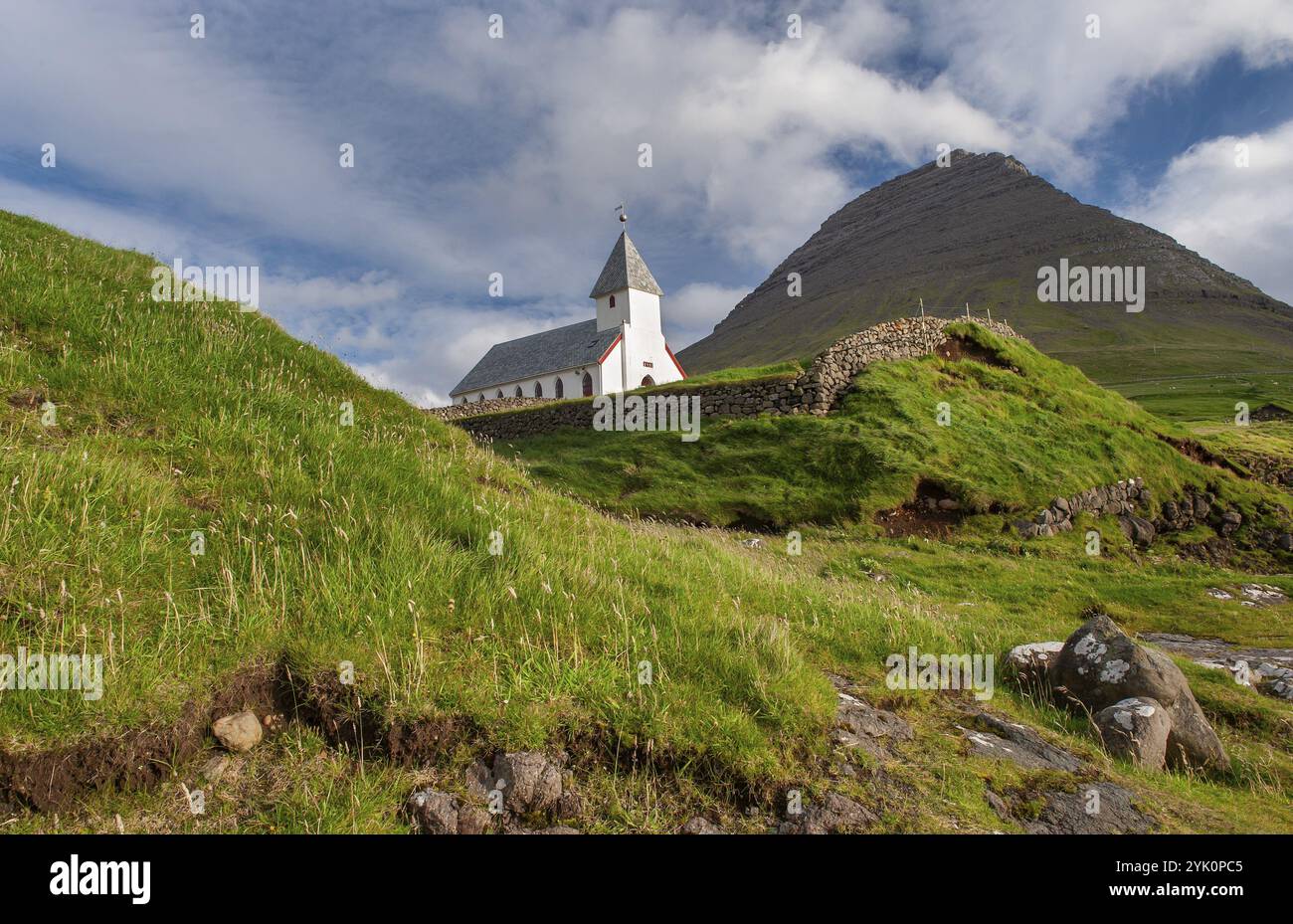 Church in front of a mountain backdrop, Malinsfjall mountain, Vidareidi ...