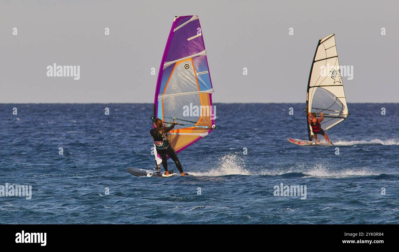 Two windsurfers competing on the water, windsurfers, Meltemi ...