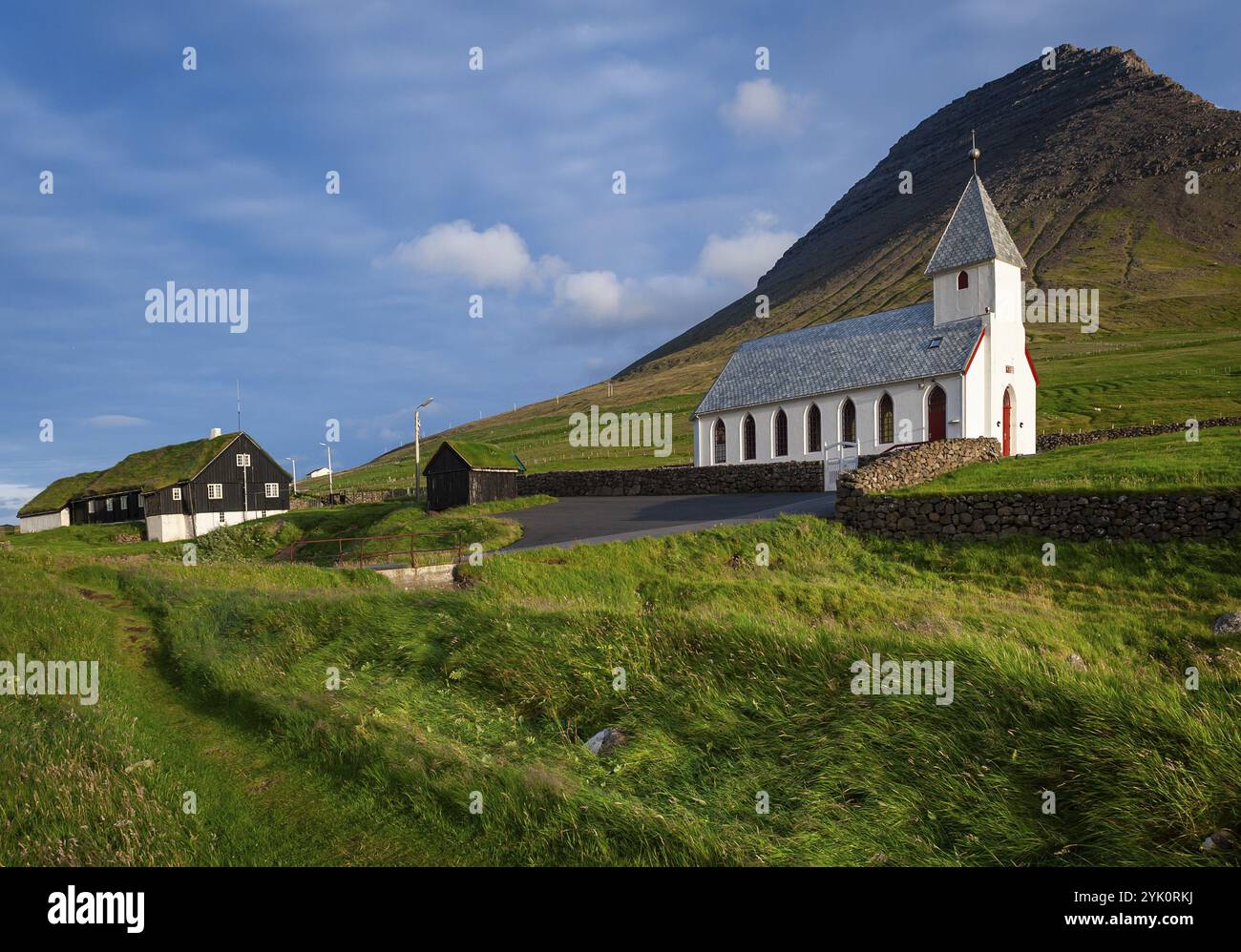 Church in front of a mountain backdrop, Malinsfjall mountain, Vidareidi ...