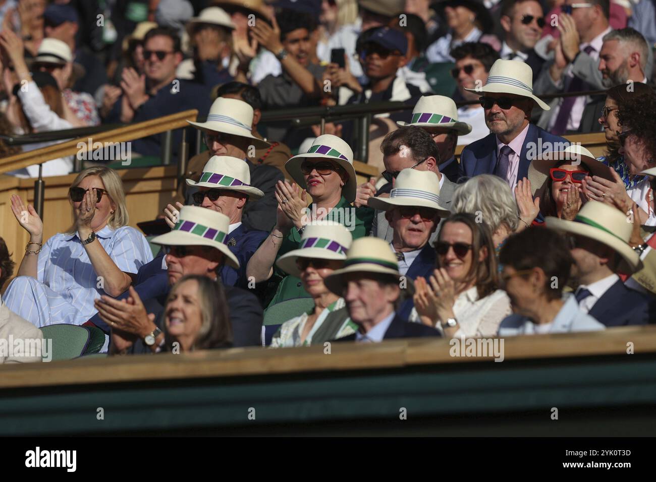 Spectators in the Royal Box wearing hats in the sun on centre court at ...