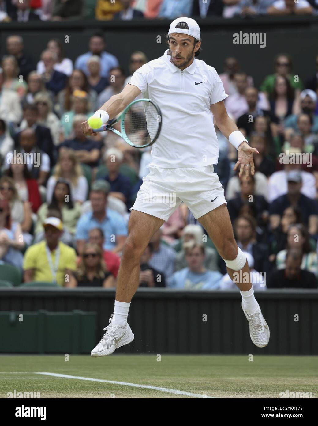 Italian tennis player Lorenzo Musetti in action at the 2024 Wimbledon ...