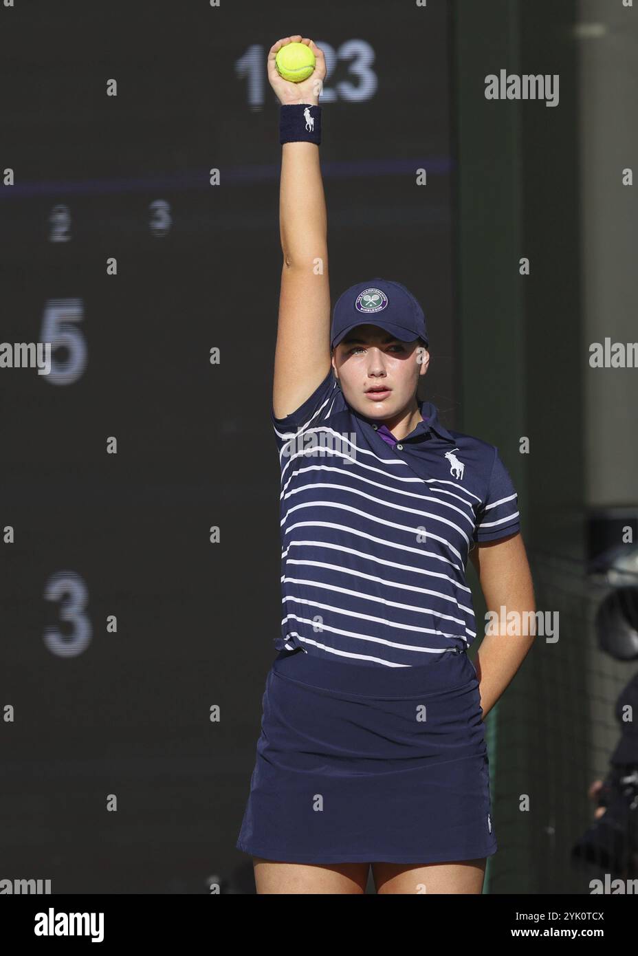 Ball girl holding up ball at the 2024 Wimbledon Championships, London ...