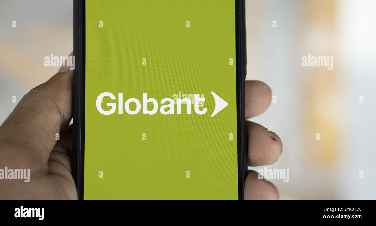 Globant logo is displayed on smartphone. Globant is an IT and software ...
