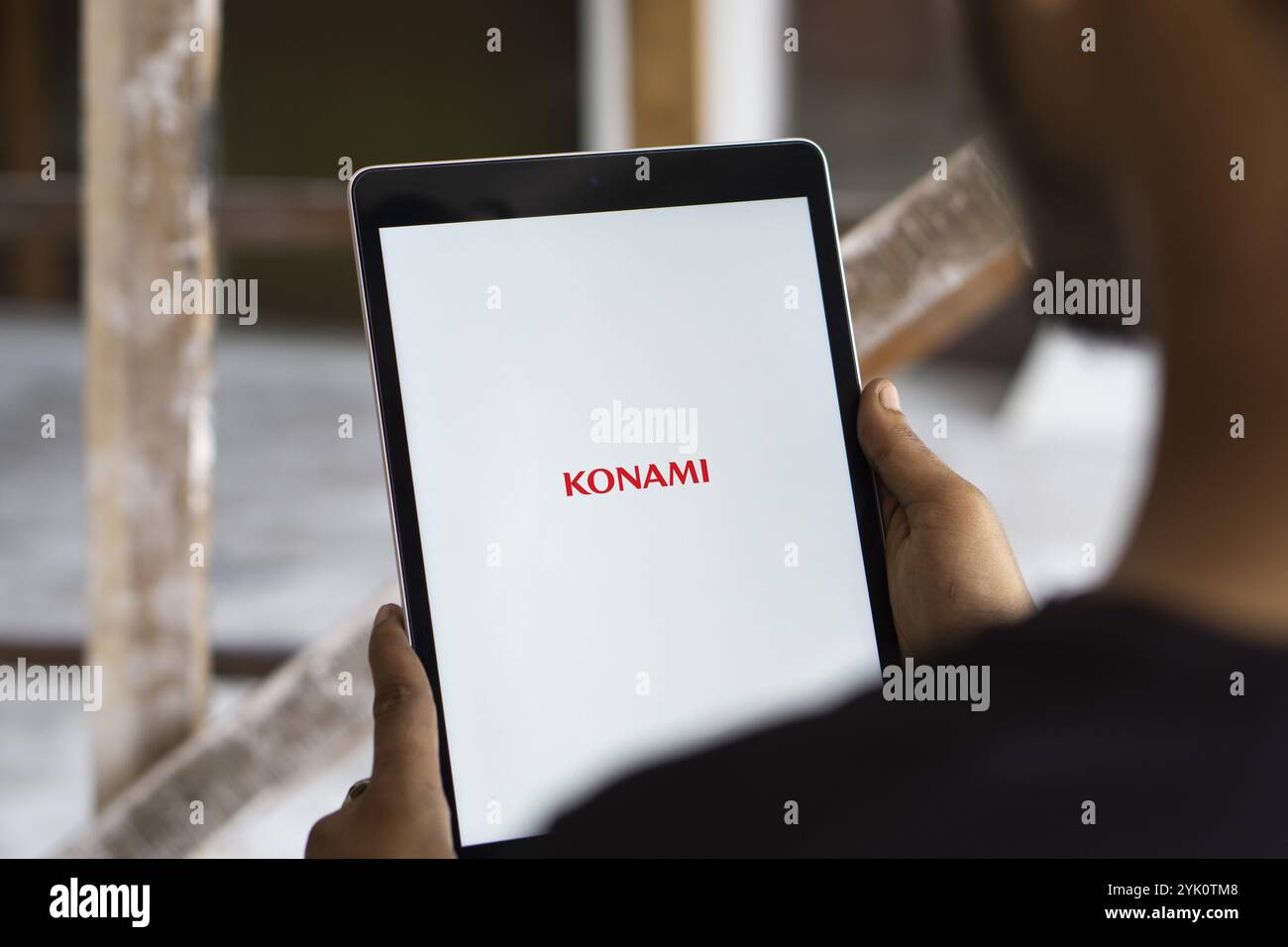 Konami logo is displayed on iPad. KKonami is a Japanese multinational ...