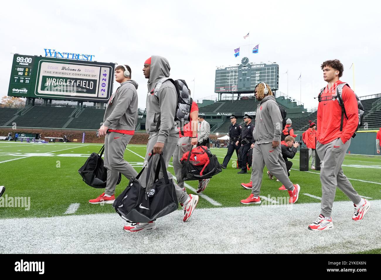 Members of the Ohio State football team walk across Wrigley Field as ...