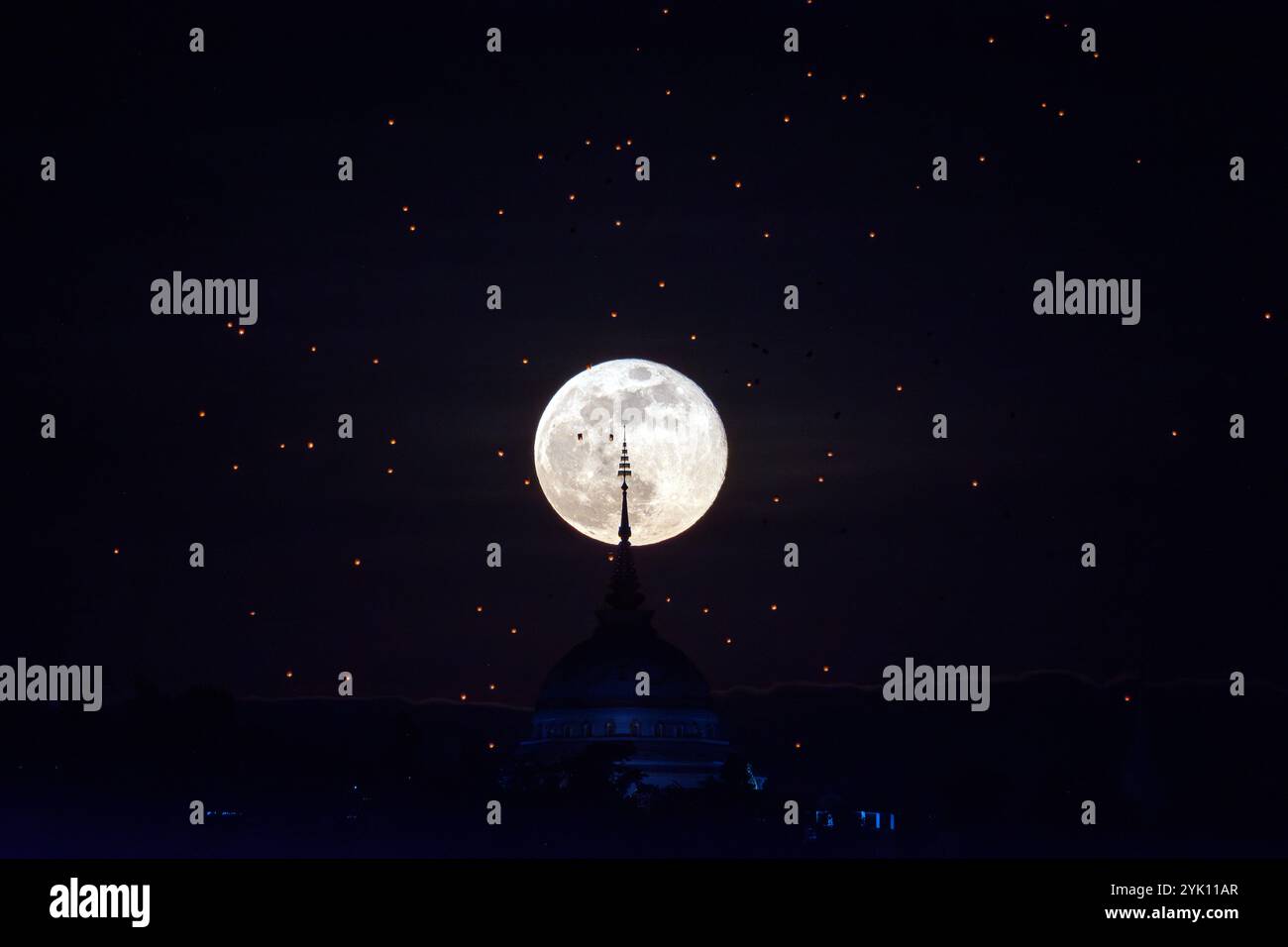 The full moon rises behind the Buddha’s Footprint of Yonok City ...