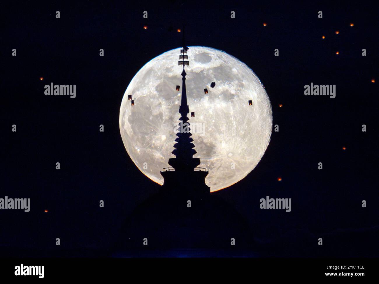 The full moon rises behind the Buddha’s Footprint of Yonok City ...