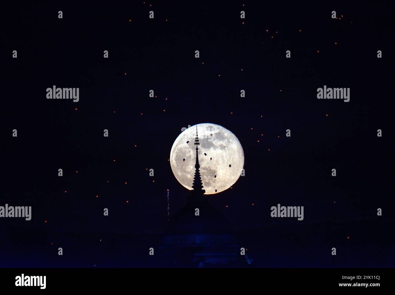 The full moon rises behind the Buddha’s Footprint of Yonok City ...