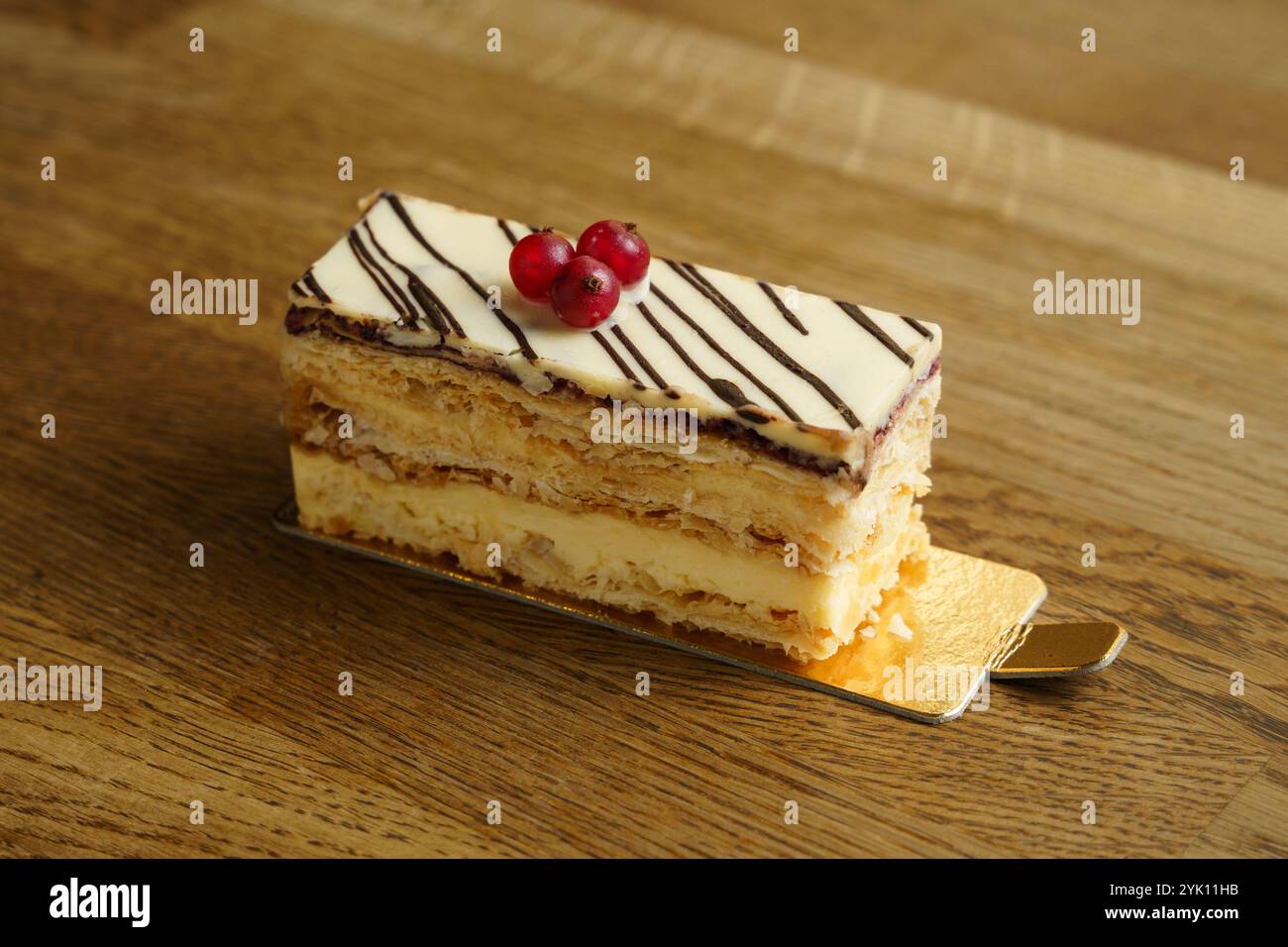 A delectable slice of mille-feuille pastry featuring layers of crispy ...