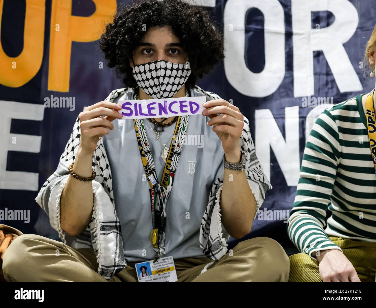 Climate activist holds a placard during a protest to influence ...
