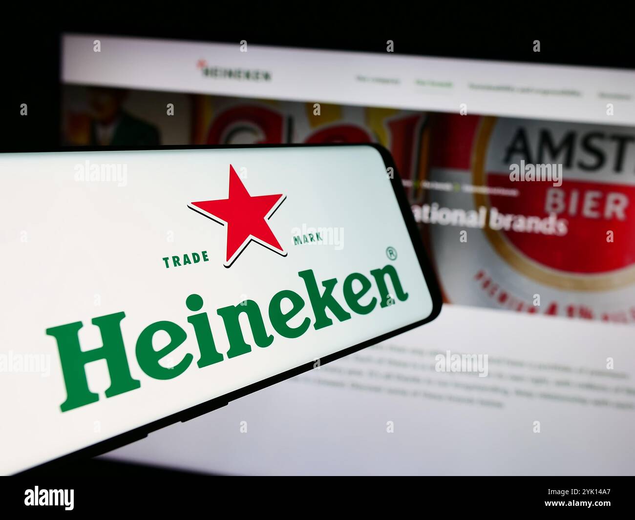 In this photo illustration, a cellphone with the logo of Dutch brewing ...