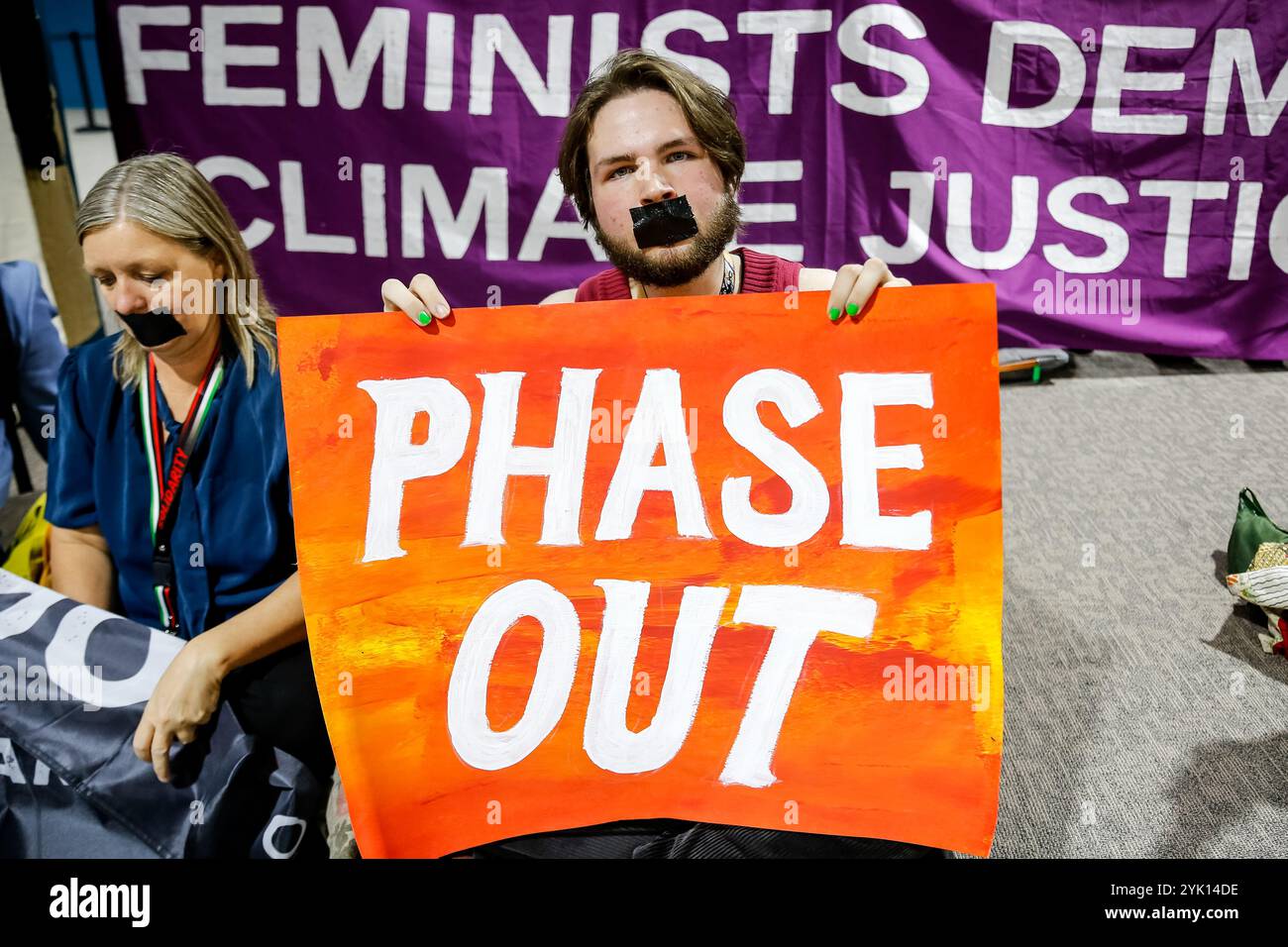 Climate activist holds a placard during a protest to influence ...