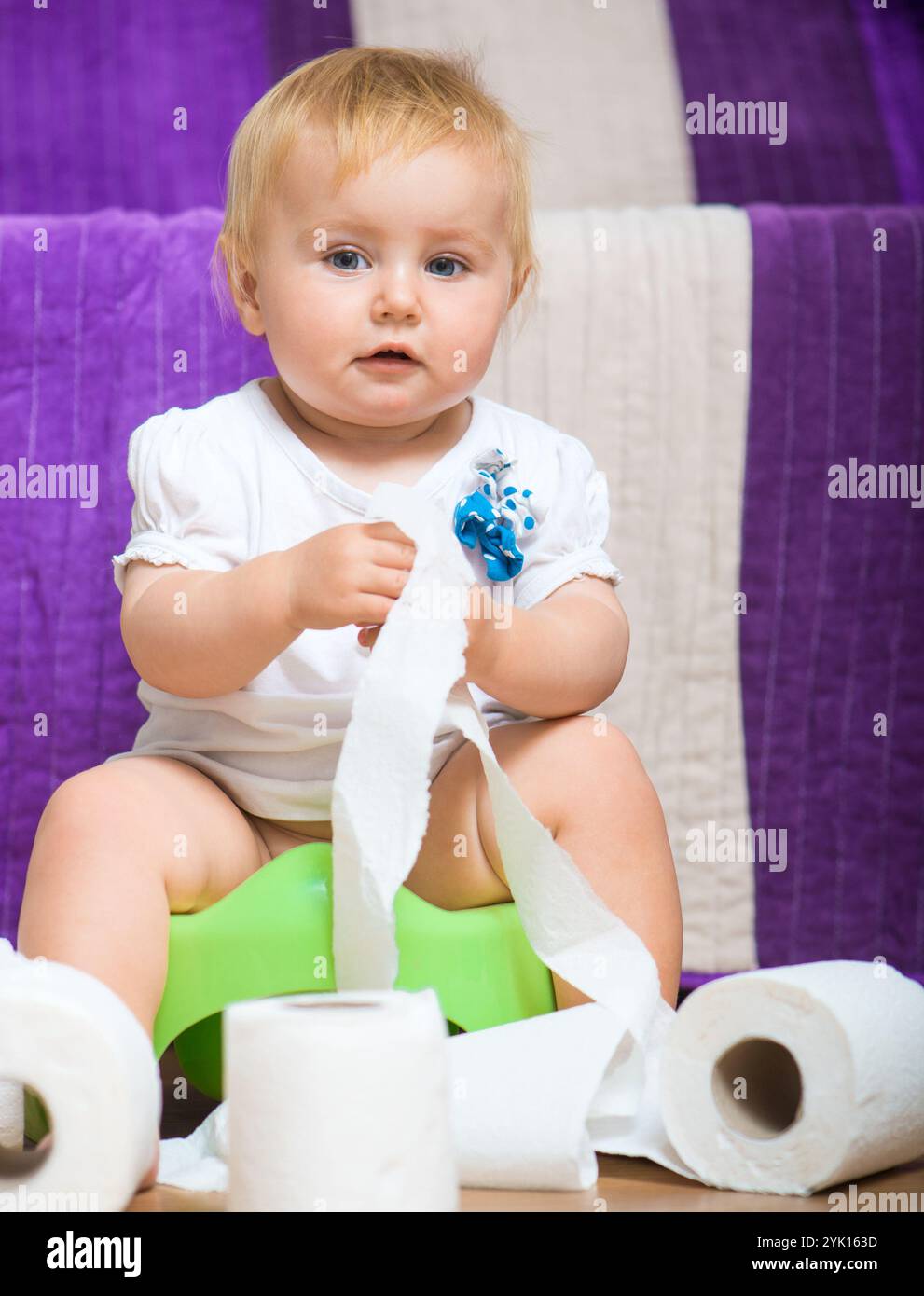 adorable baby on the potty with toilet paper Stock Photo - Alamy