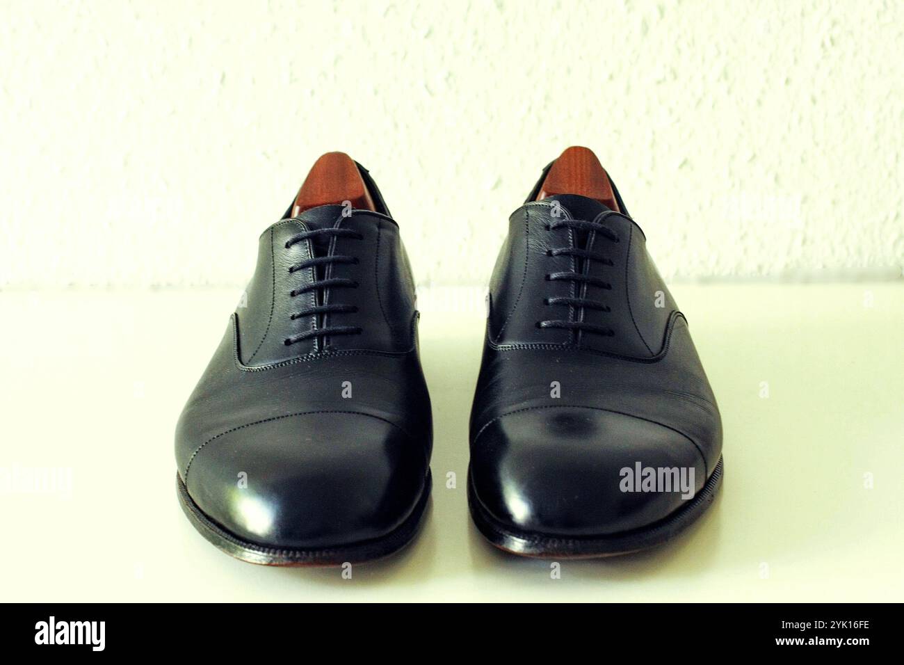Premium black handmade bespoke shoes with trees from front Stock Photo ...