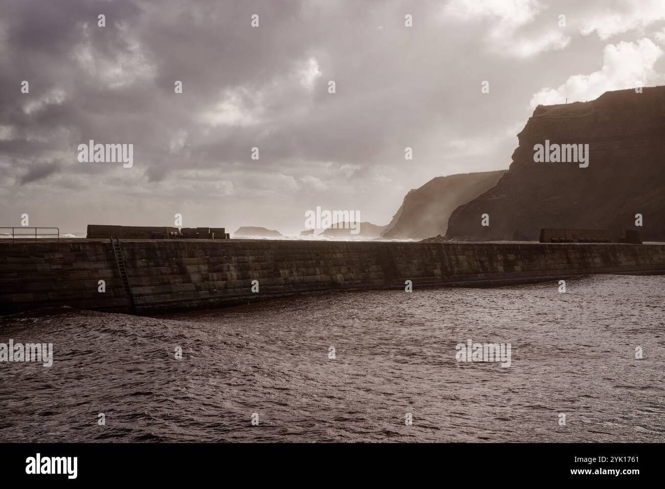 The sea lashes the cliffs in stormy weather at Whitby, North Yorkshire ...