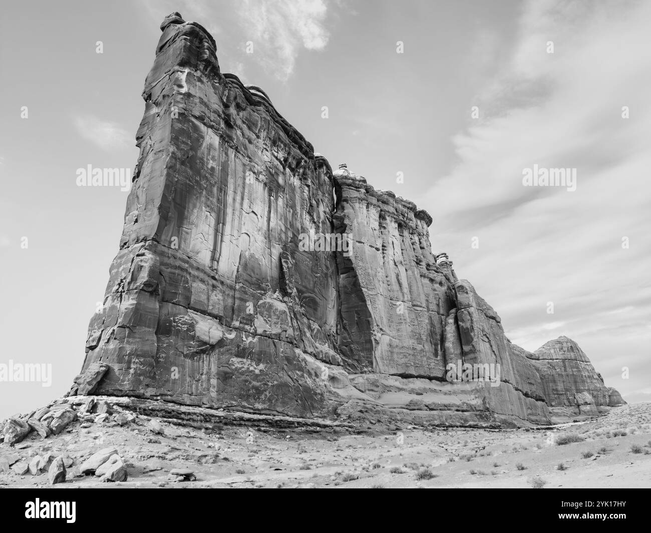 Dramatic black-and-white view of a monumental desert rock formation ...