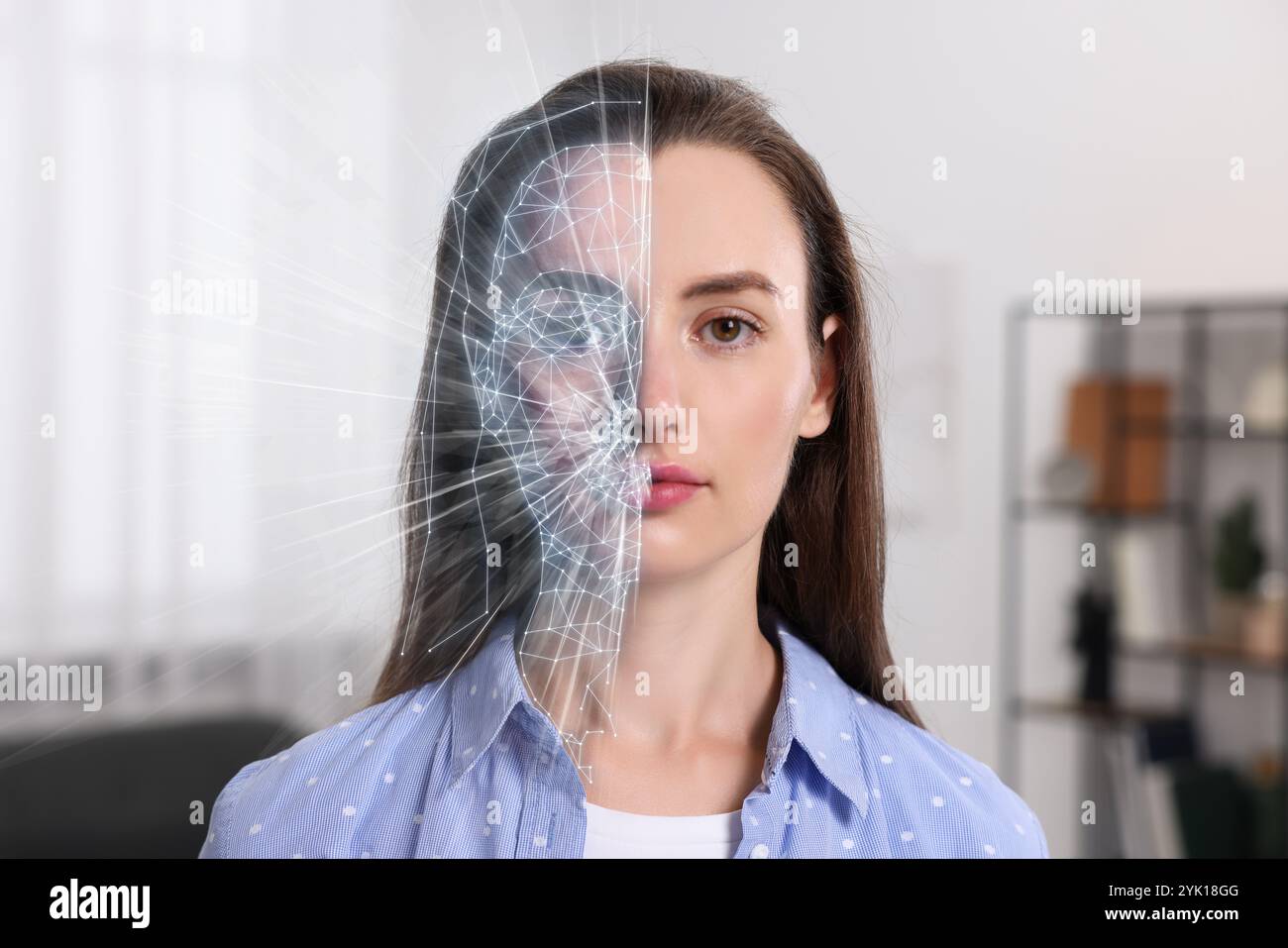 Facial recognition system. Woman undergoing biometric verification at ...