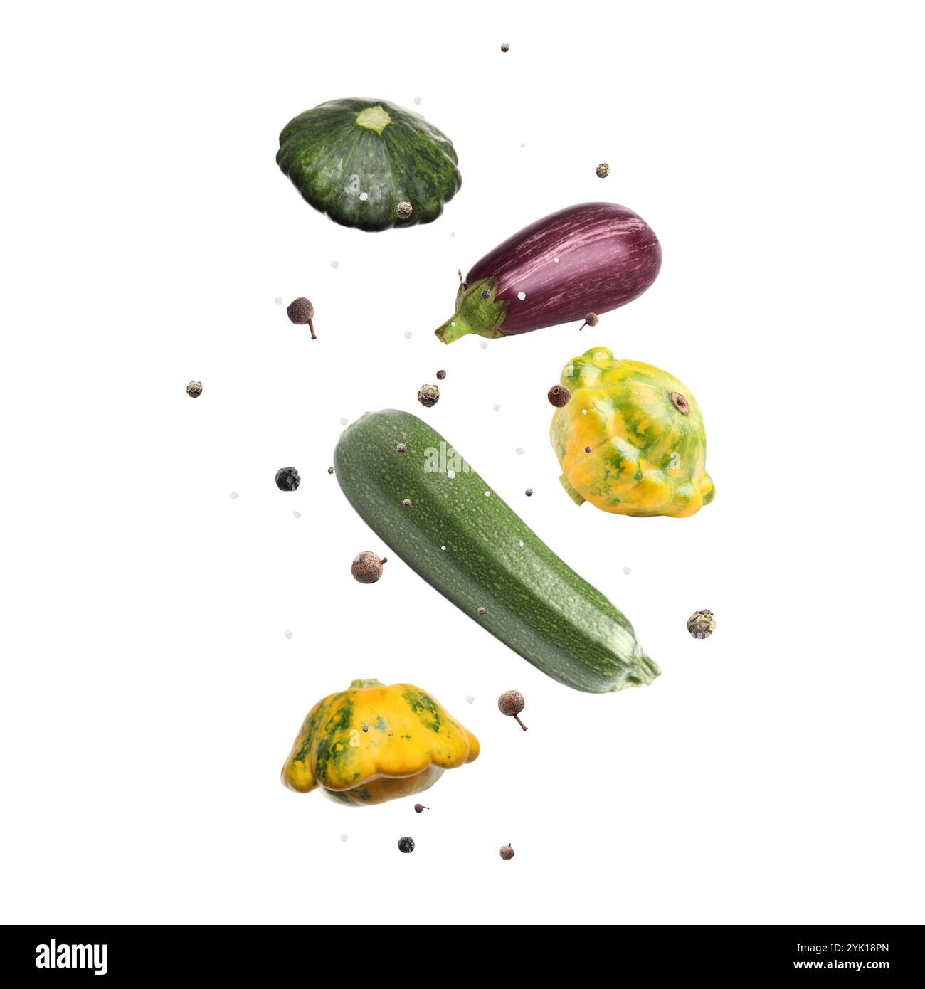 Pattypan squashes, zucchini, eggplant and spices in air on white ...