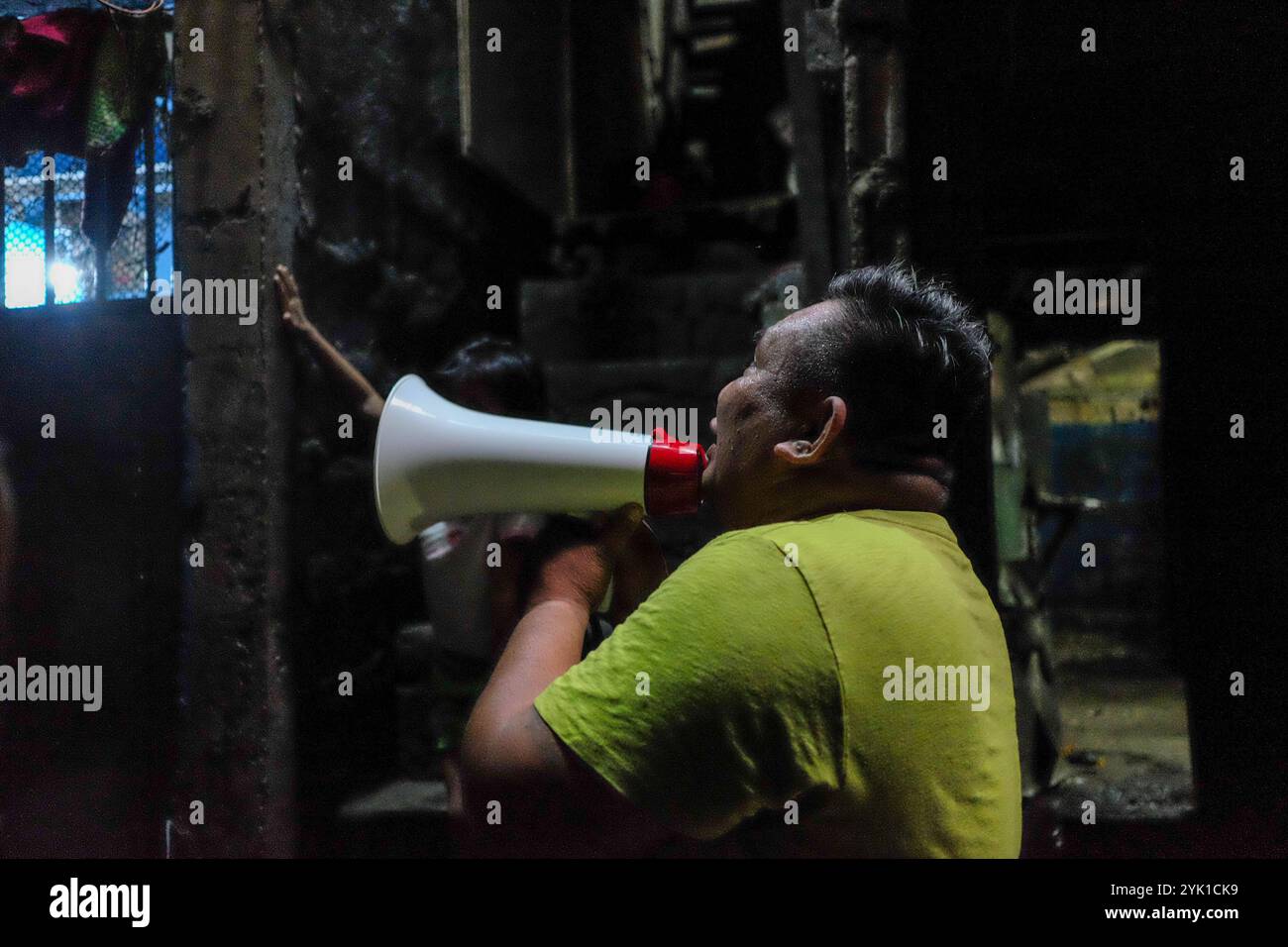 Village officials and personnel from the Quezon City Disaster Risk Reduction and Management ...