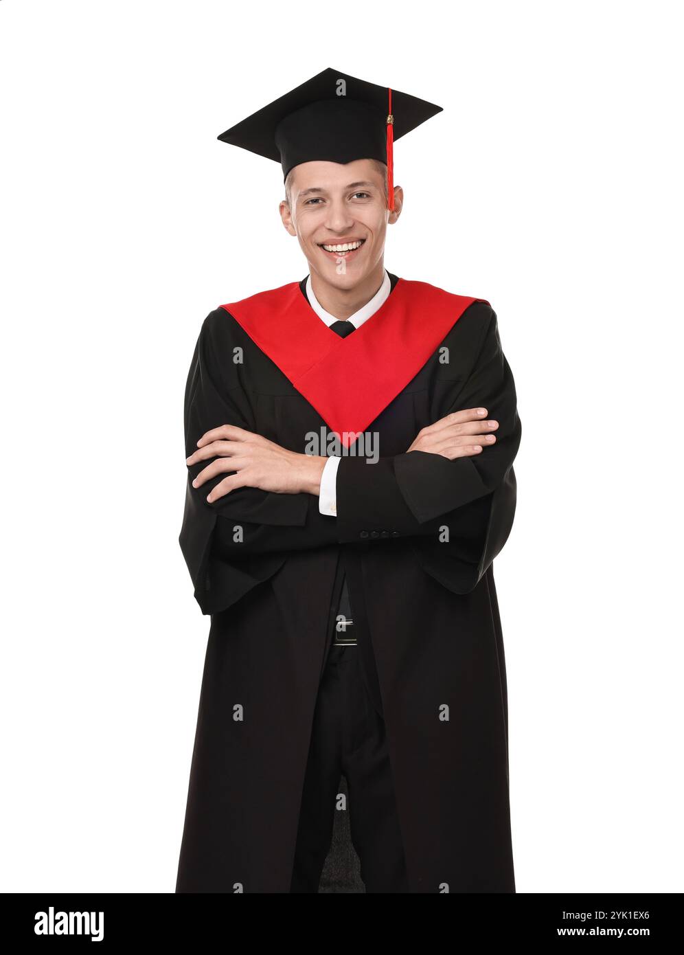 Happy student with crossed arms after graduation on white background ...