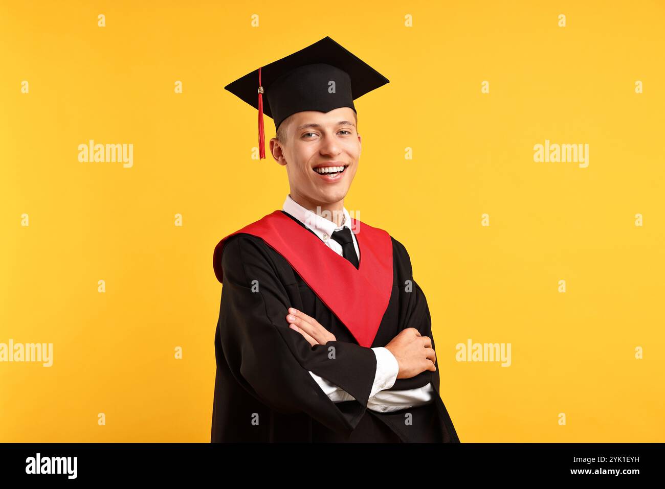 Graduate man confident arms crossed hi-res stock photography and images ...