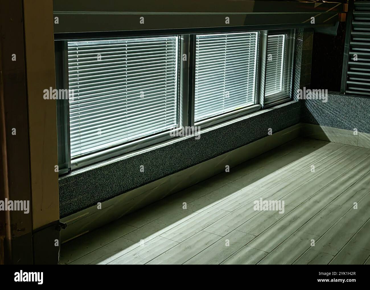 Illuminated Closed Windows with Blinds at Night Stock Photo - Alamy