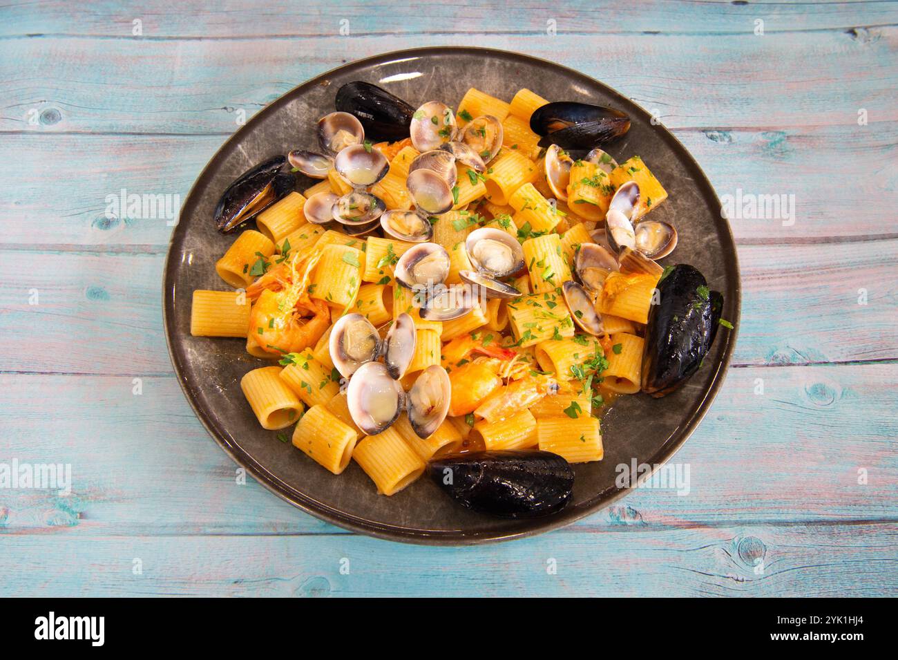 Mezze maniche pasta with seafood is the name of a typical seafood dish ...